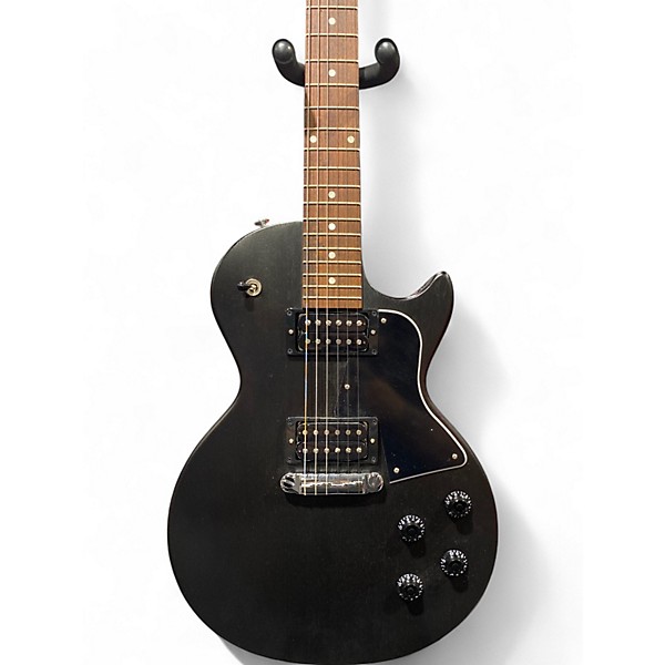 Used Gibson Les Paul Tribute WORN EBONY Solid Body Electric Guitar WORN EBONY | Guitar Center